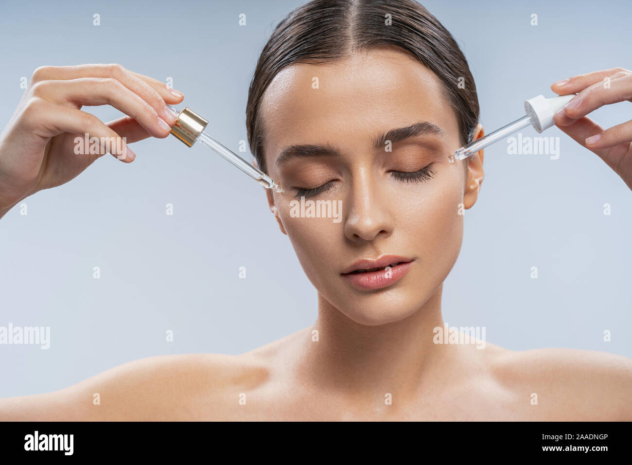 Cheerful female person going to test cosmetics Stock Photo - Alamy