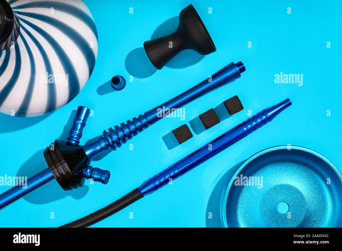 Parts of blue decorated hookah or shisha on light blue backgroun Stock ...