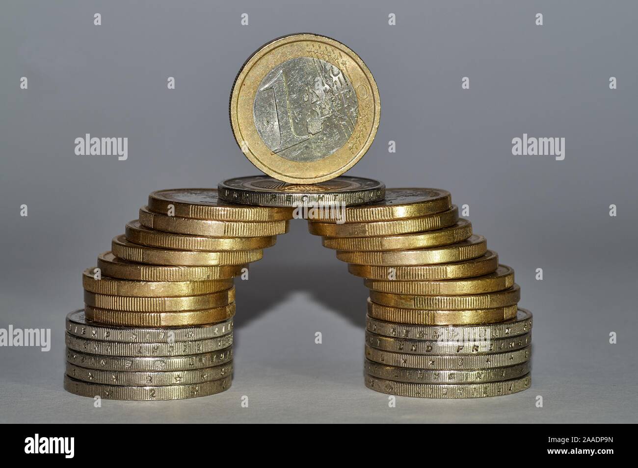 Euro coins stacked in different positions Stock Photo - Alamy