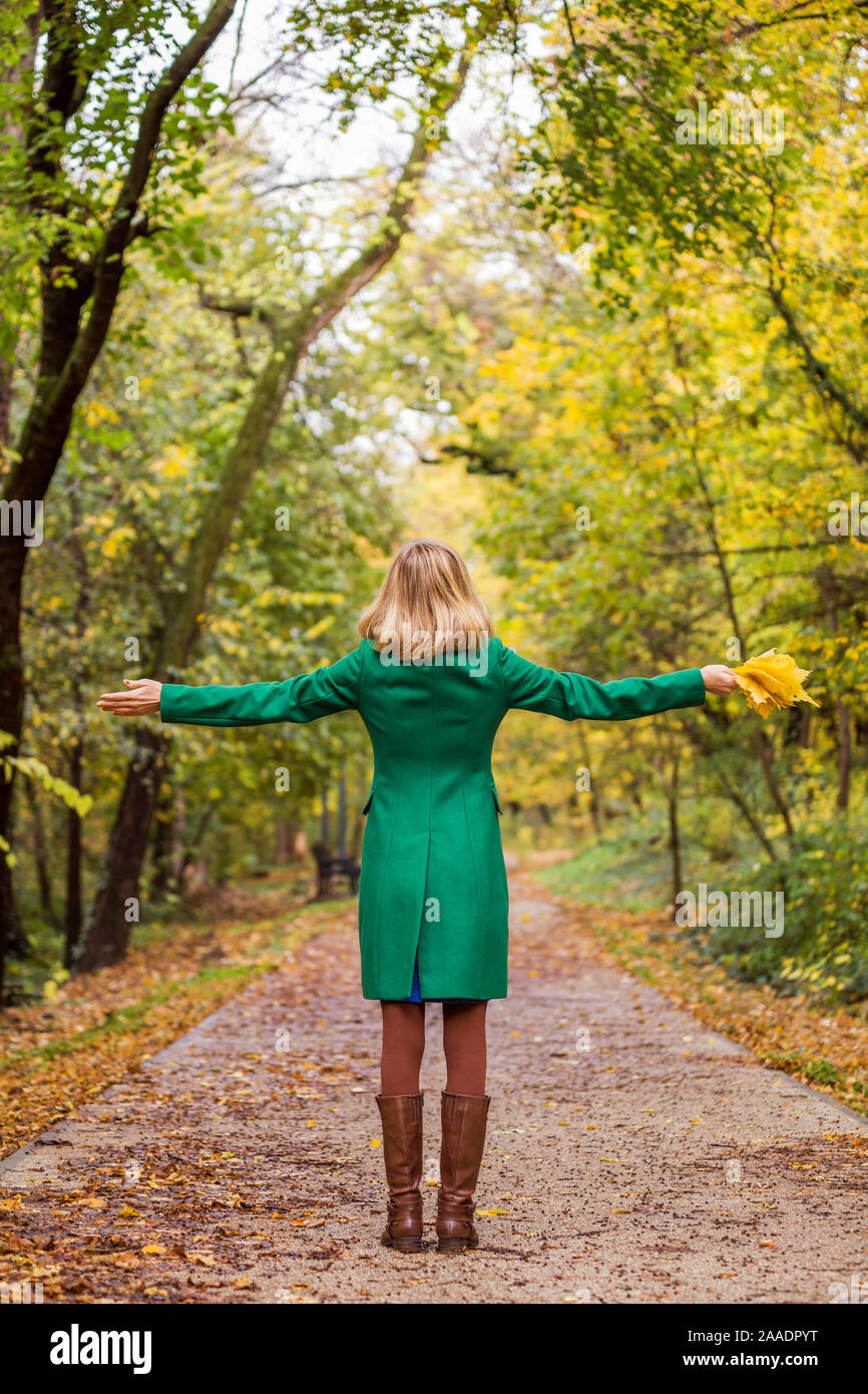 Woman autumn outstretched arms one person hi-res stock photography and ...