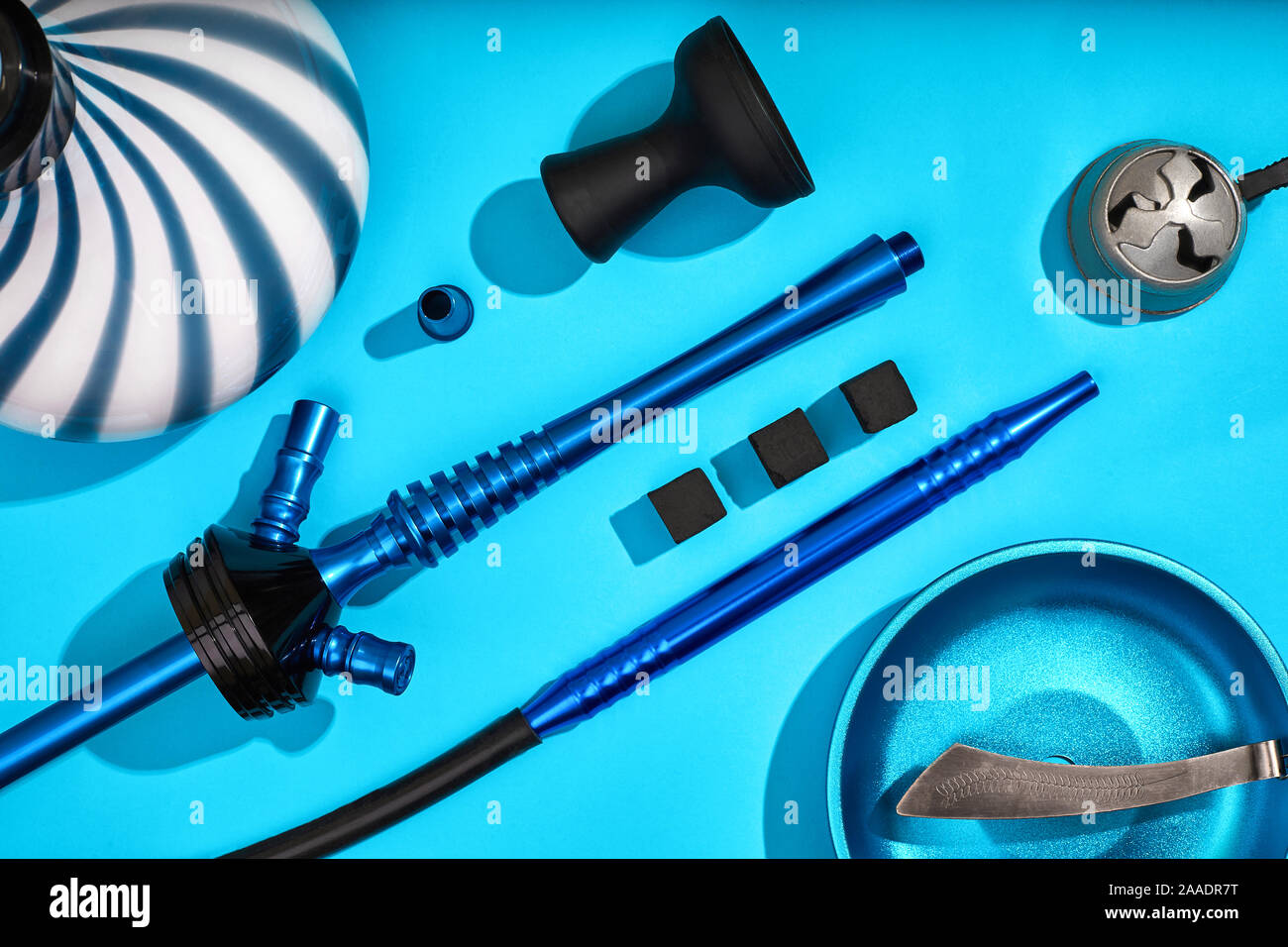 Parts of blue decorated hookah or shisha on light blue backgroun Stock ...