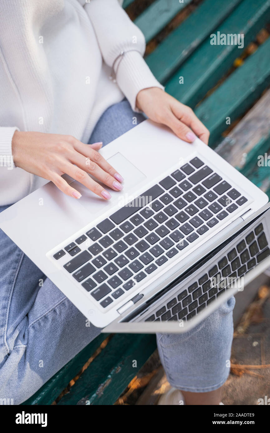Top view photo of female person that holding laptop Stock Photo - Alamy