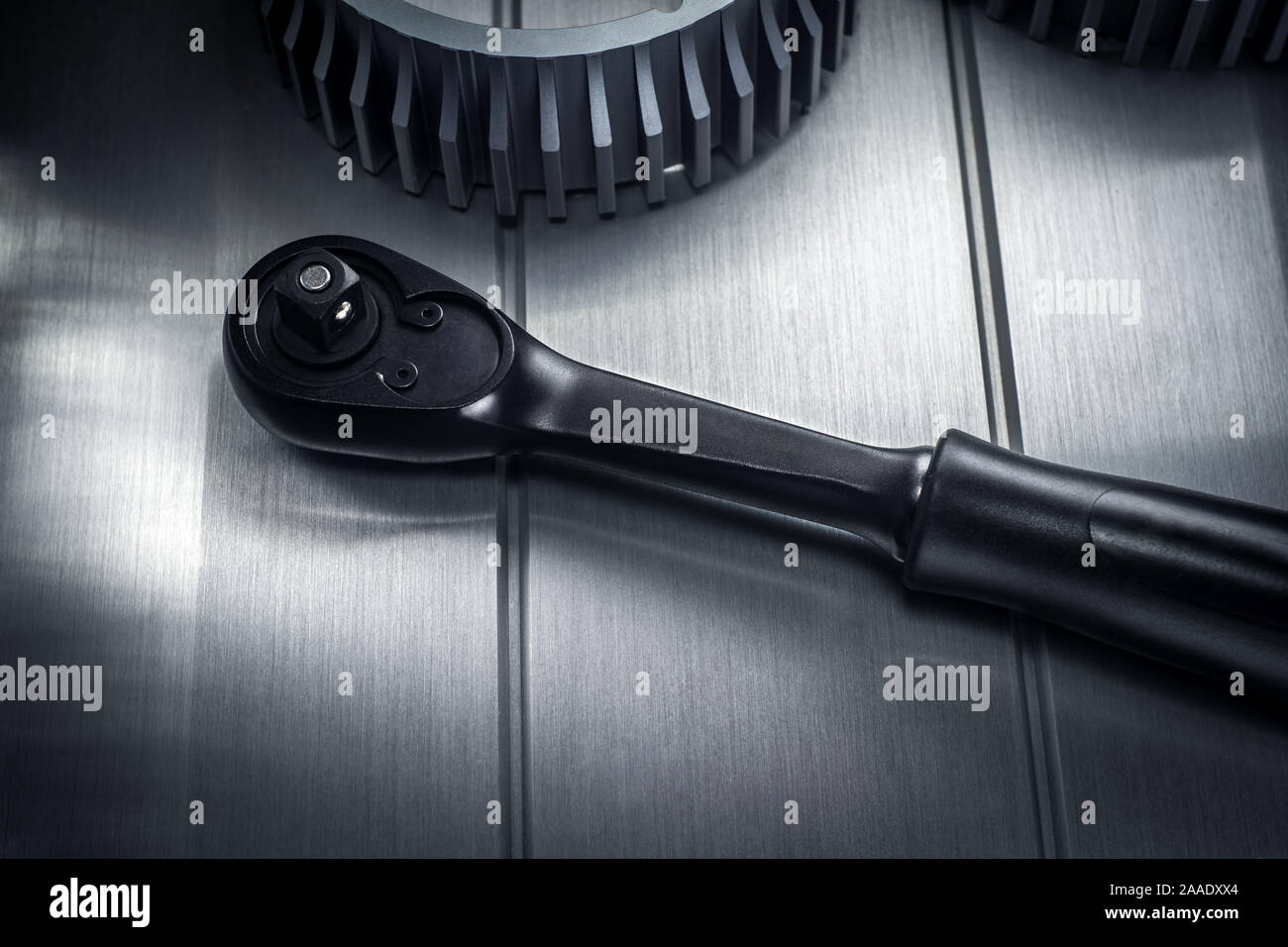 Reinforced professional black matt hex wrench placed on a polished ...