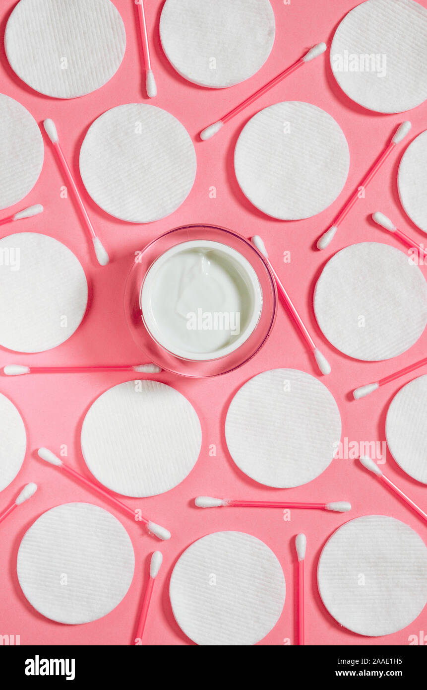 Hygiene products: white round cotton pads and plastic sticks for ...