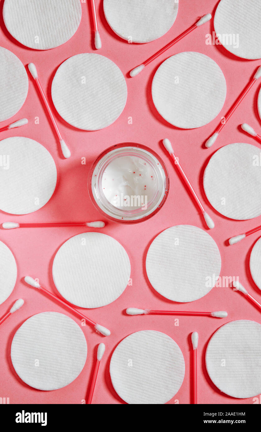 Hygiene products: white round cotton pads and plastic sticks for ...