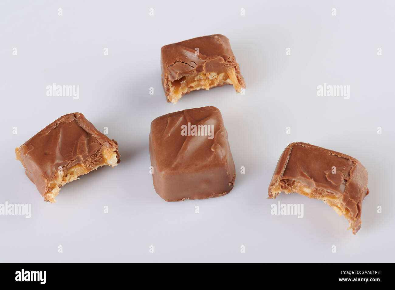 Candy bars with bites isolated on white background Stock Photo - Alamy