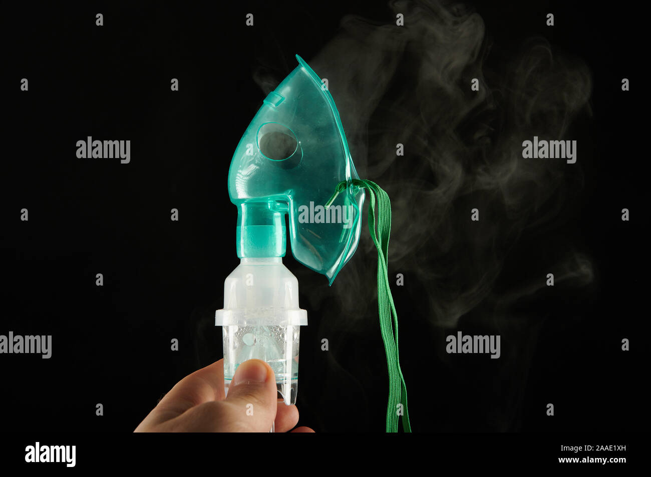 Hand holding medical inhalation mask close up view isolated Stock Photo ...