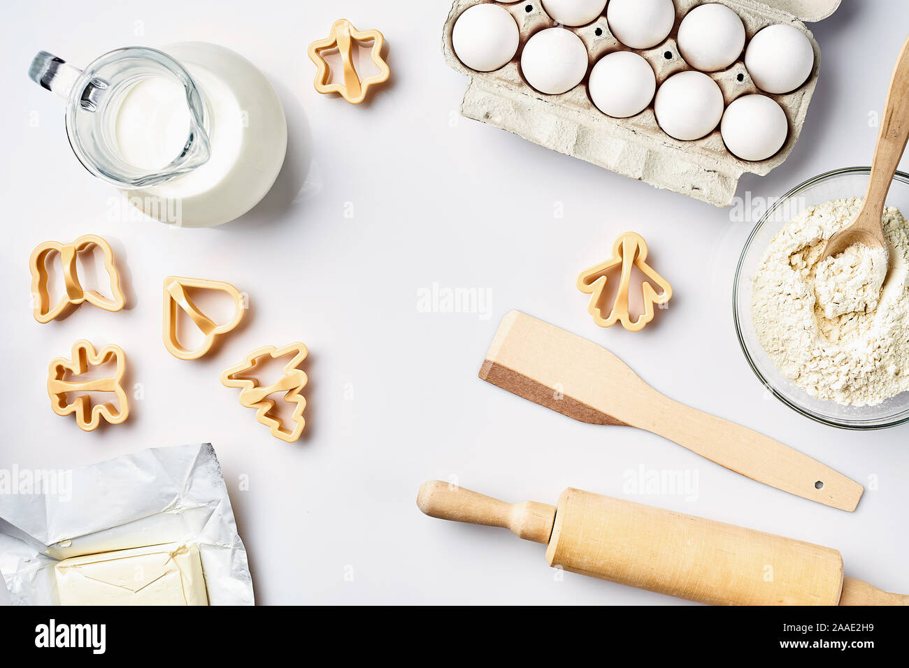 Objects and ingredients for baking, plastic molds for cookies on a ...