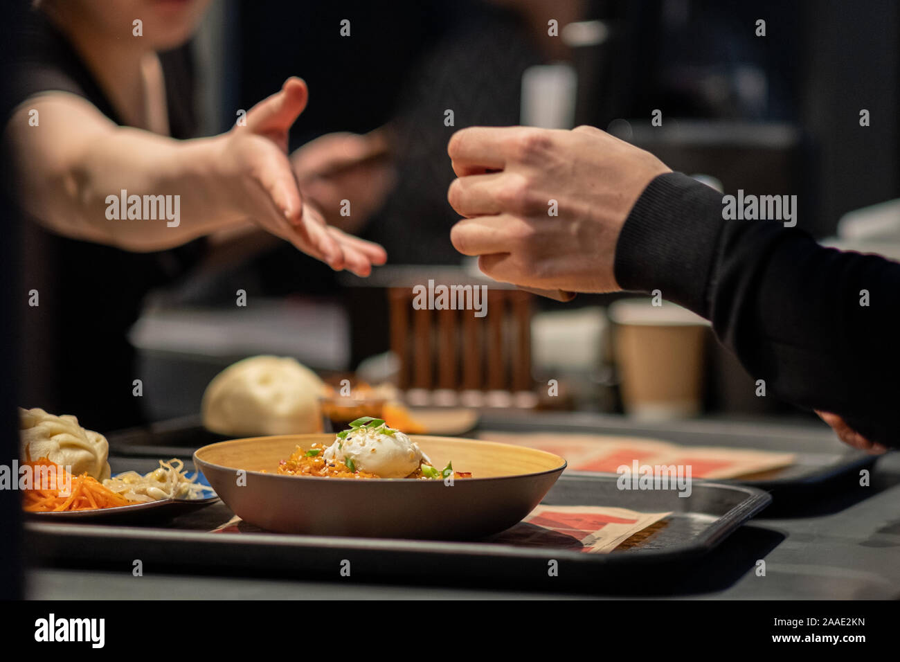 Hands giving over a table hi-res stock photography and images - Alamy