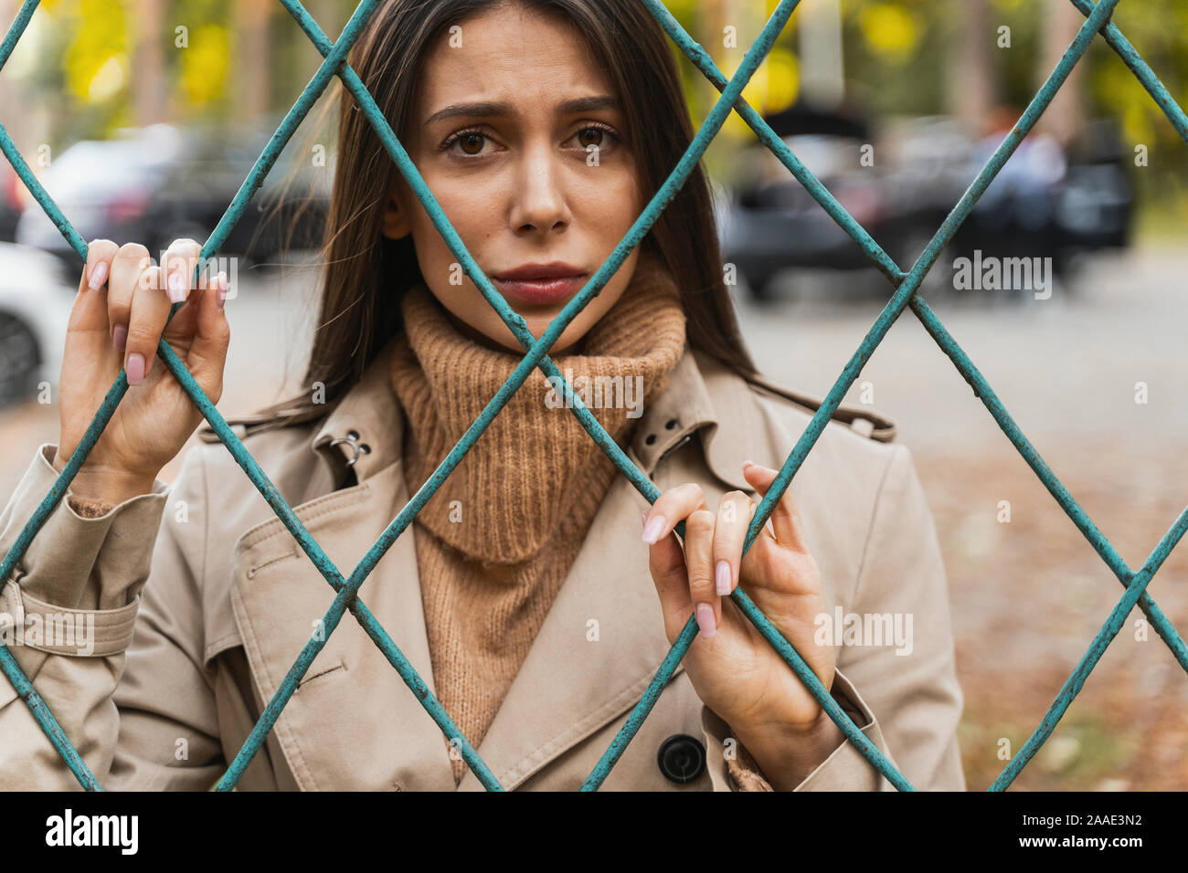 Sad female person looking straight at camera Stock Photo - Alamy