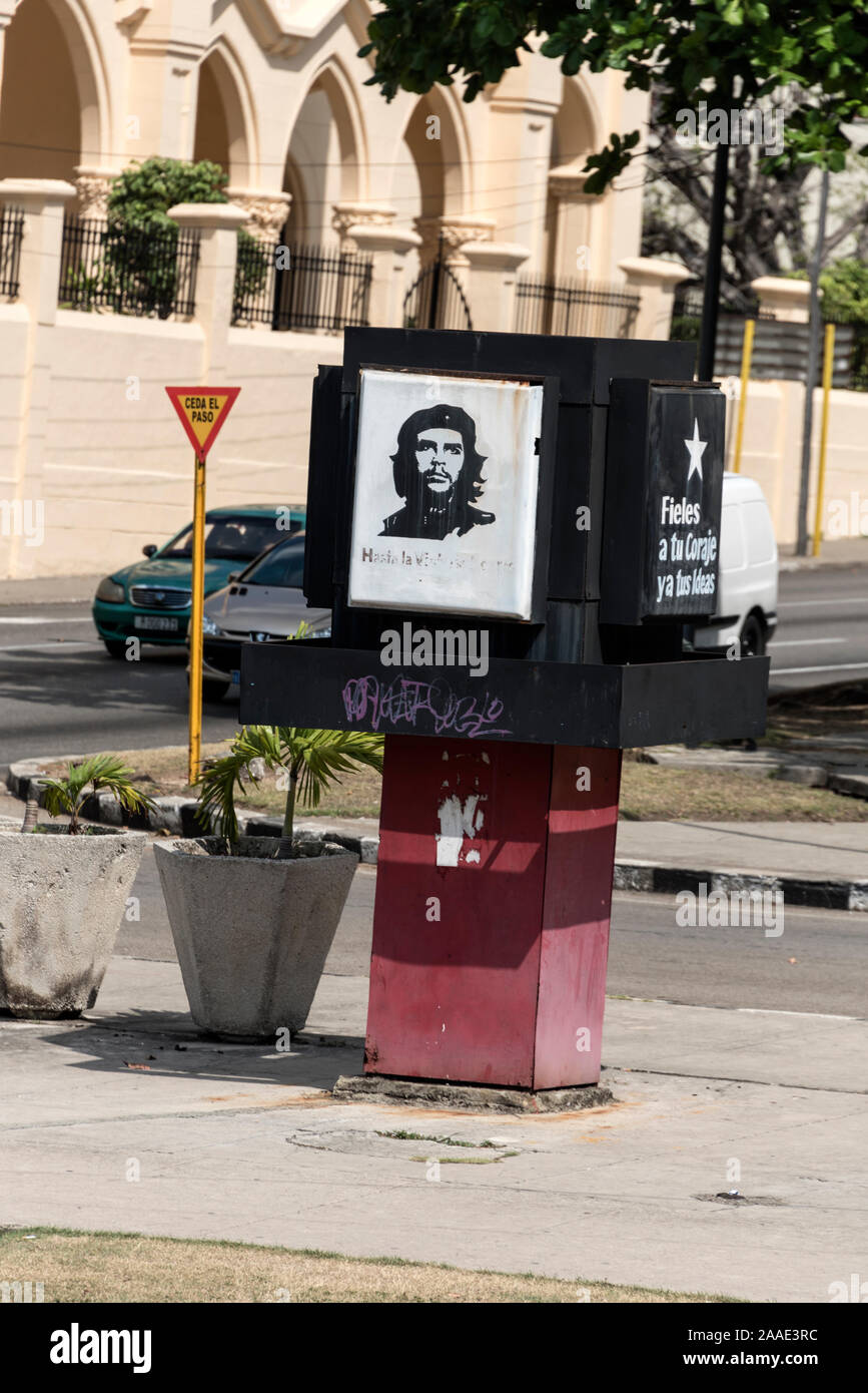 A portrait of Cuban revolutionary leader, Che Guevara on a road stand ...