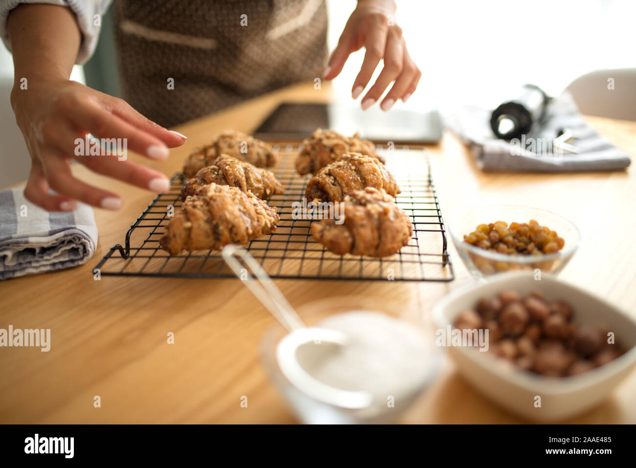 Young woman in the kitchen serves baked cookies Stock Photo - Alamy