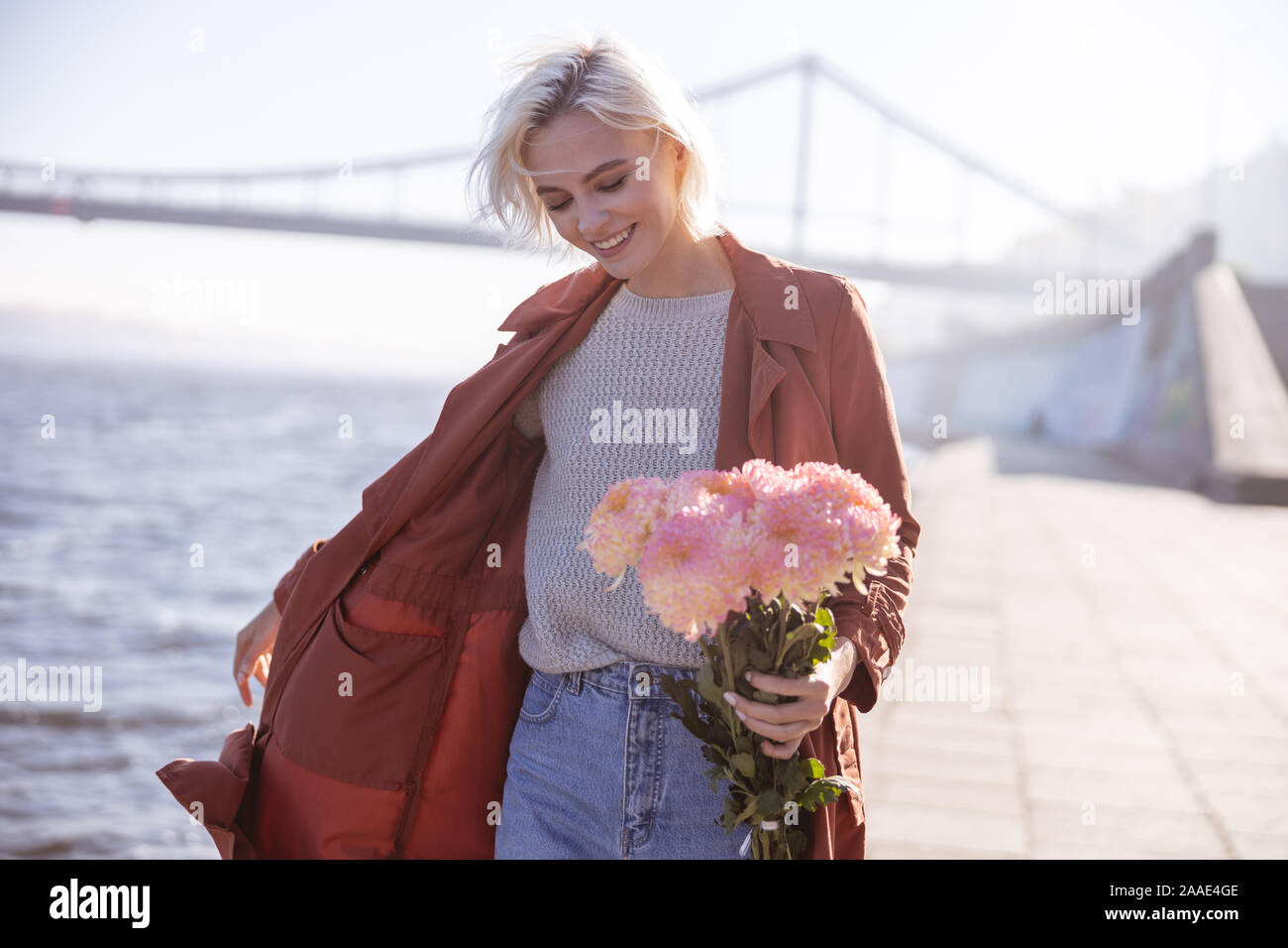 Lady walking in the wind hi-res stock photography and images - Alamy
