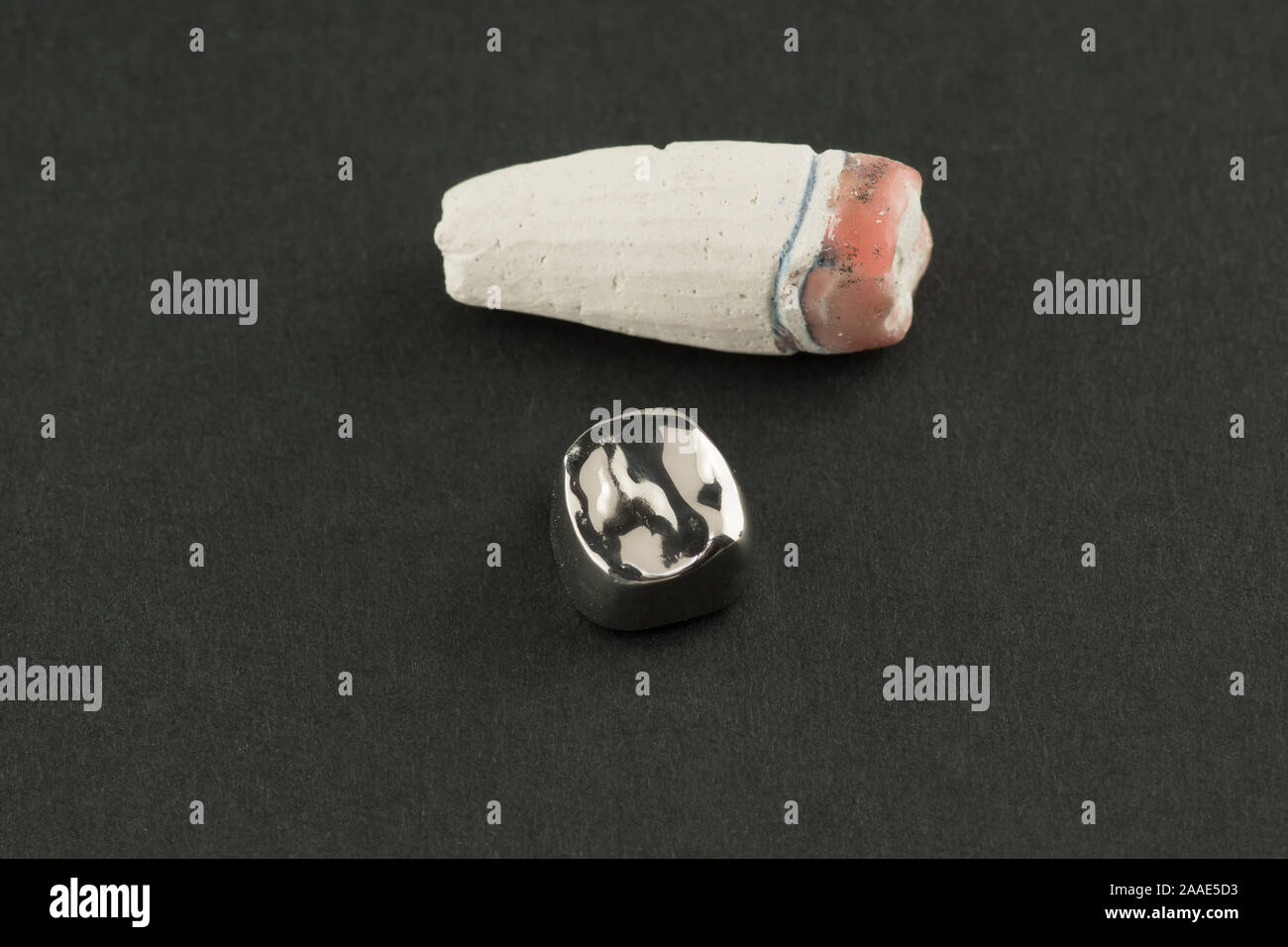 Dental metal tooth crowns isolated on white background Stock Photo - Alamy