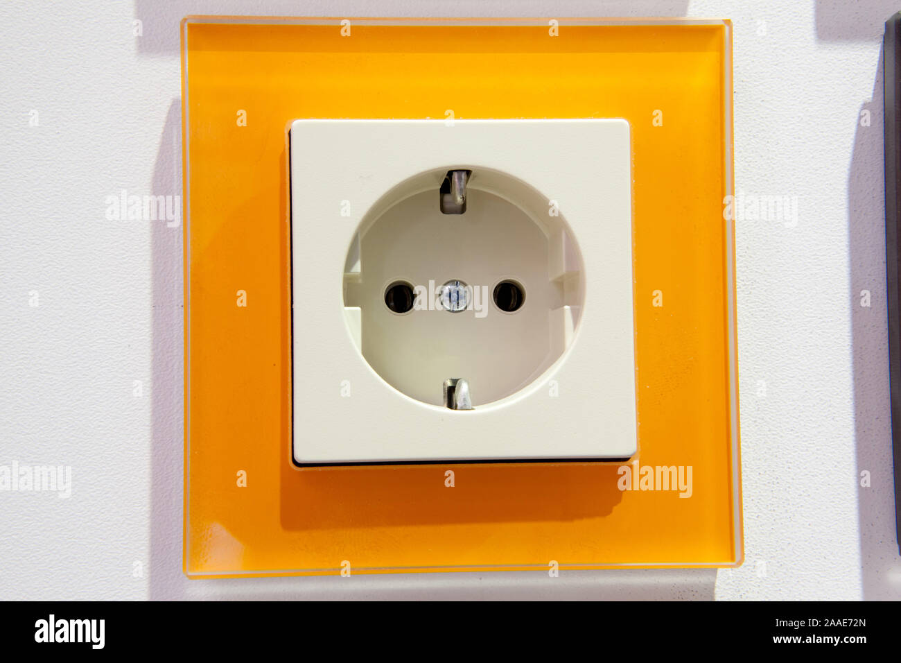 Modern European standard electrical outlet on the wall close up with ...