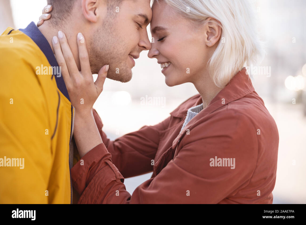 Young people being happy holding each other close Stock Photo - Alamy
