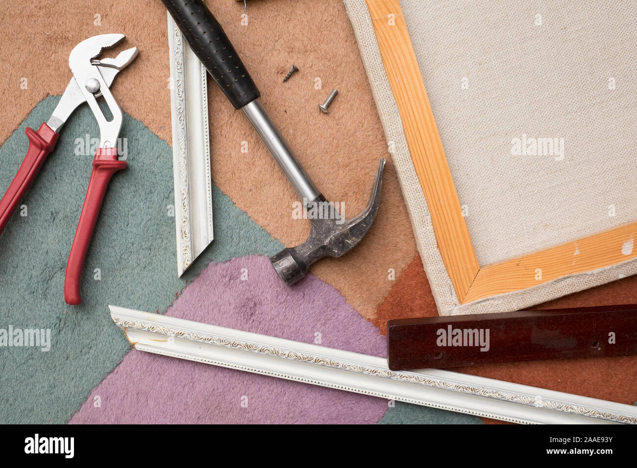 Hand tools around an artist canvas and wooden frame parts Stock Photo ...