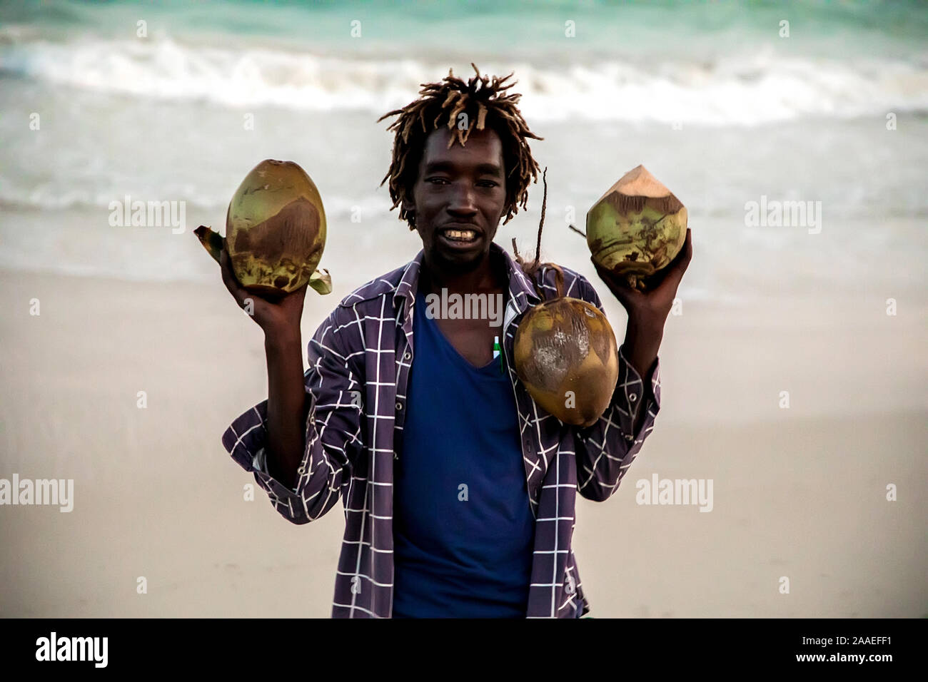 Boy with coconuts hi-res stock photography and images - Alamy