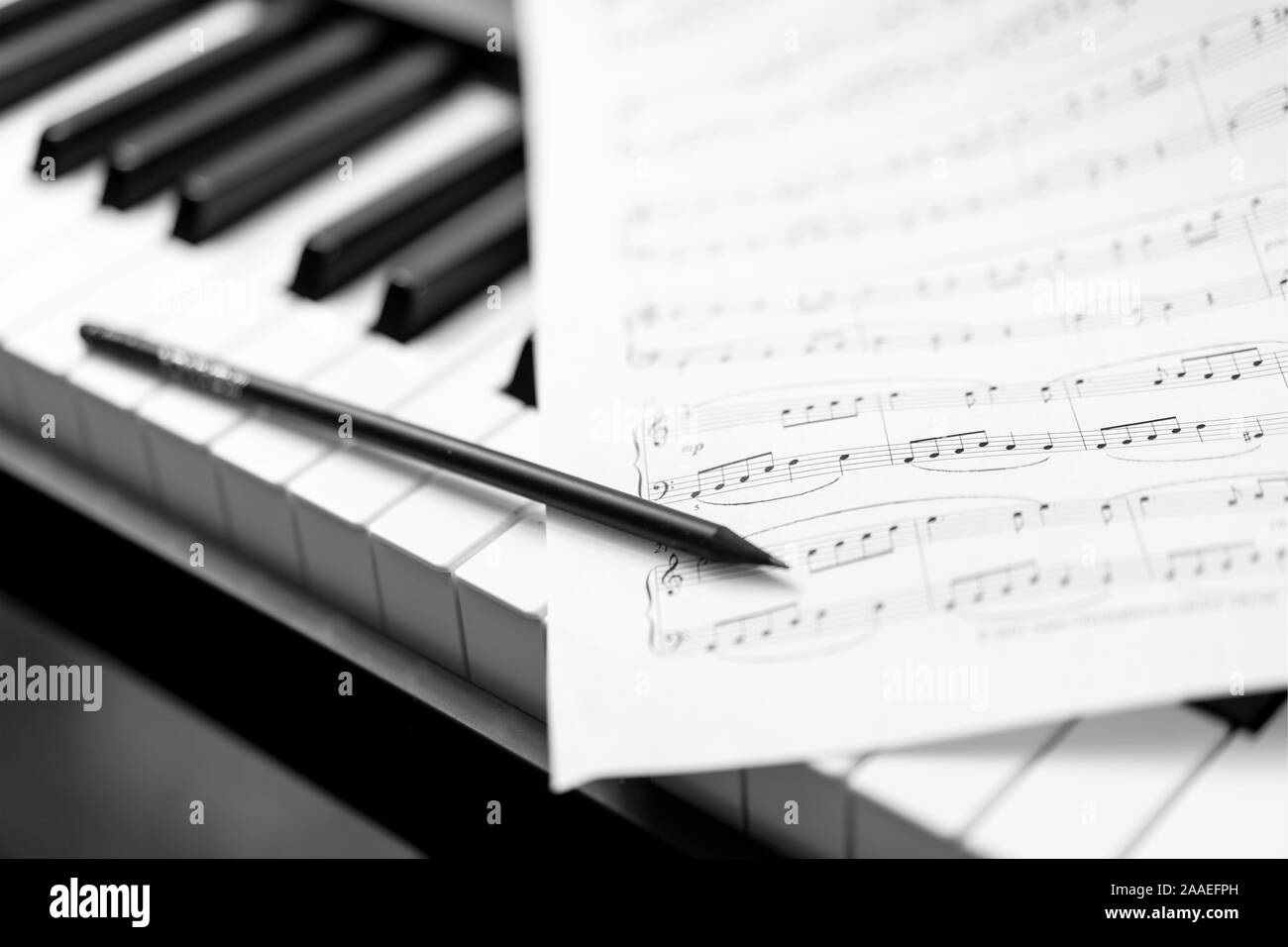 Hand With Pen And Music Sheet - Musical Background Stock Photo - Alamy