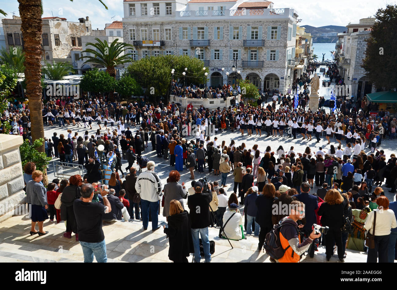 Schoolchildren and others perform a traditional dance to celebrate Ochi ...