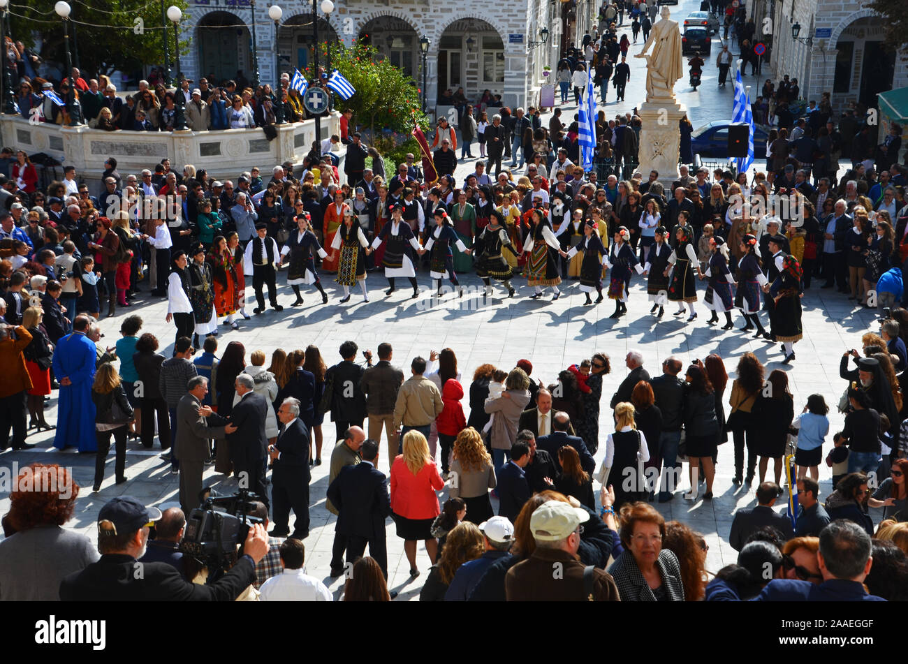 Schoolchildren and others perform a traditional dance to celebrate Ochi ...