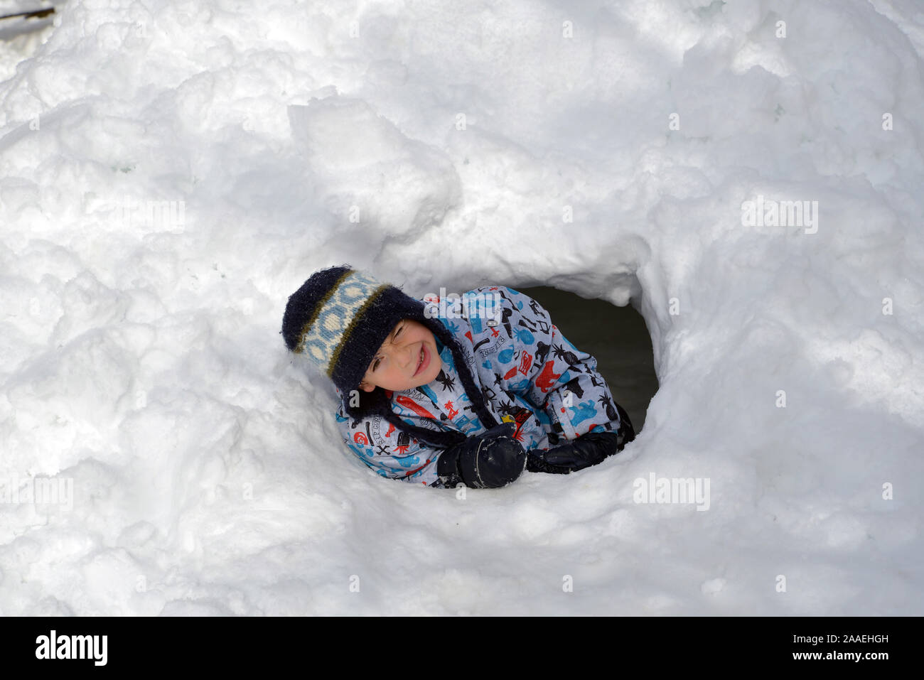 Little boy coming out of an igloo Mercury Savoie F 73 Stock Photo - Alamy