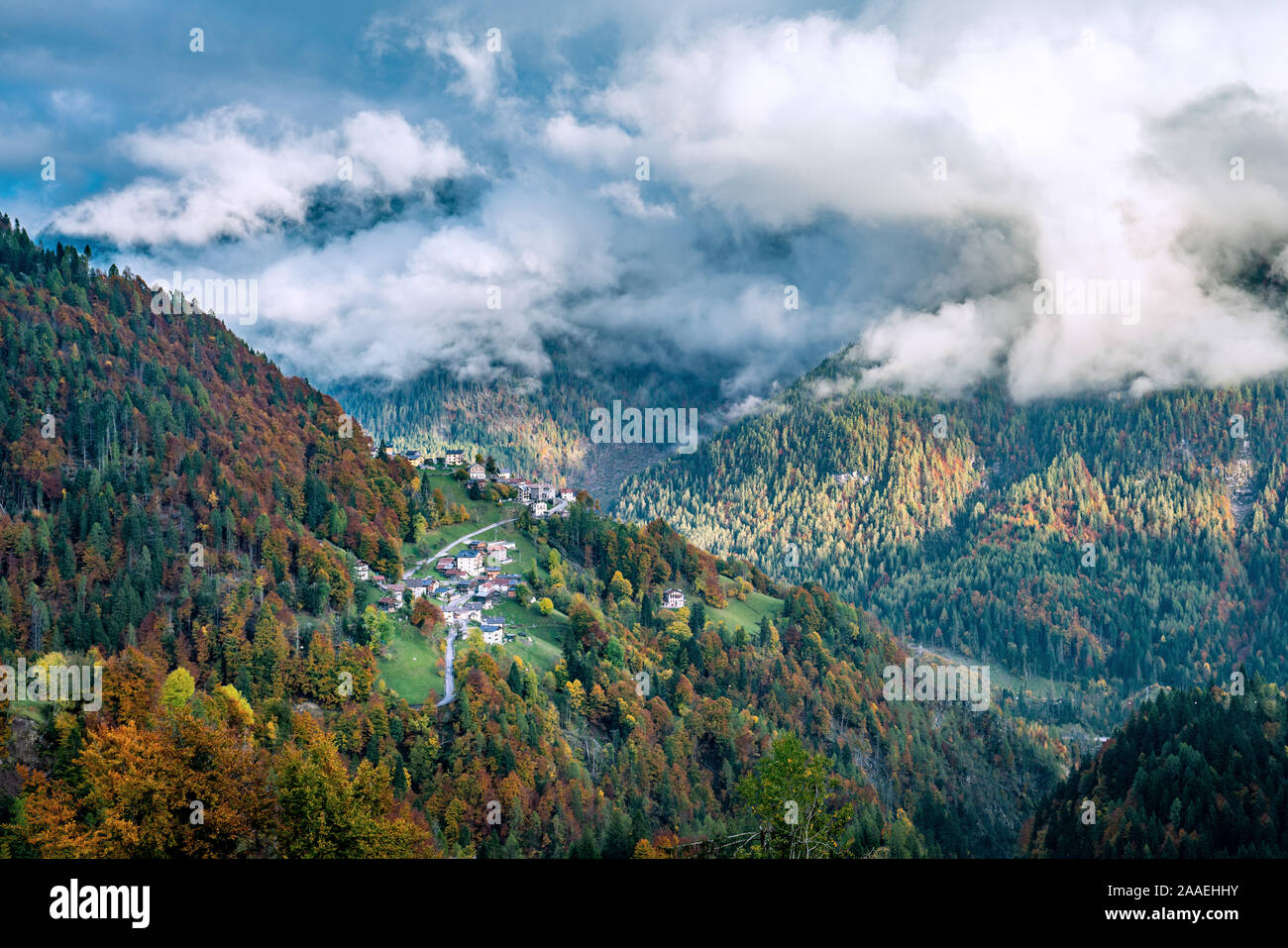 Colourful aumtumn view across the Cordevole valley with Pecol and Piaia ...