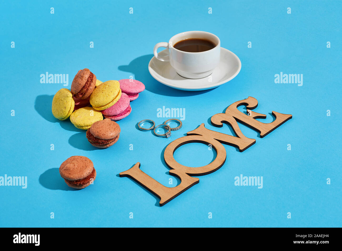 Tasty sweet macarons and coffee cup. Macaroons on blue backgroun Stock ...