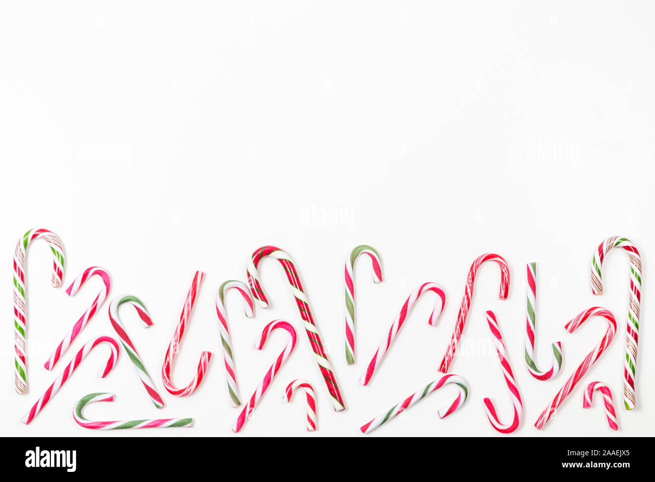 Candy canes border frame on white background. Top view, copy space ...
