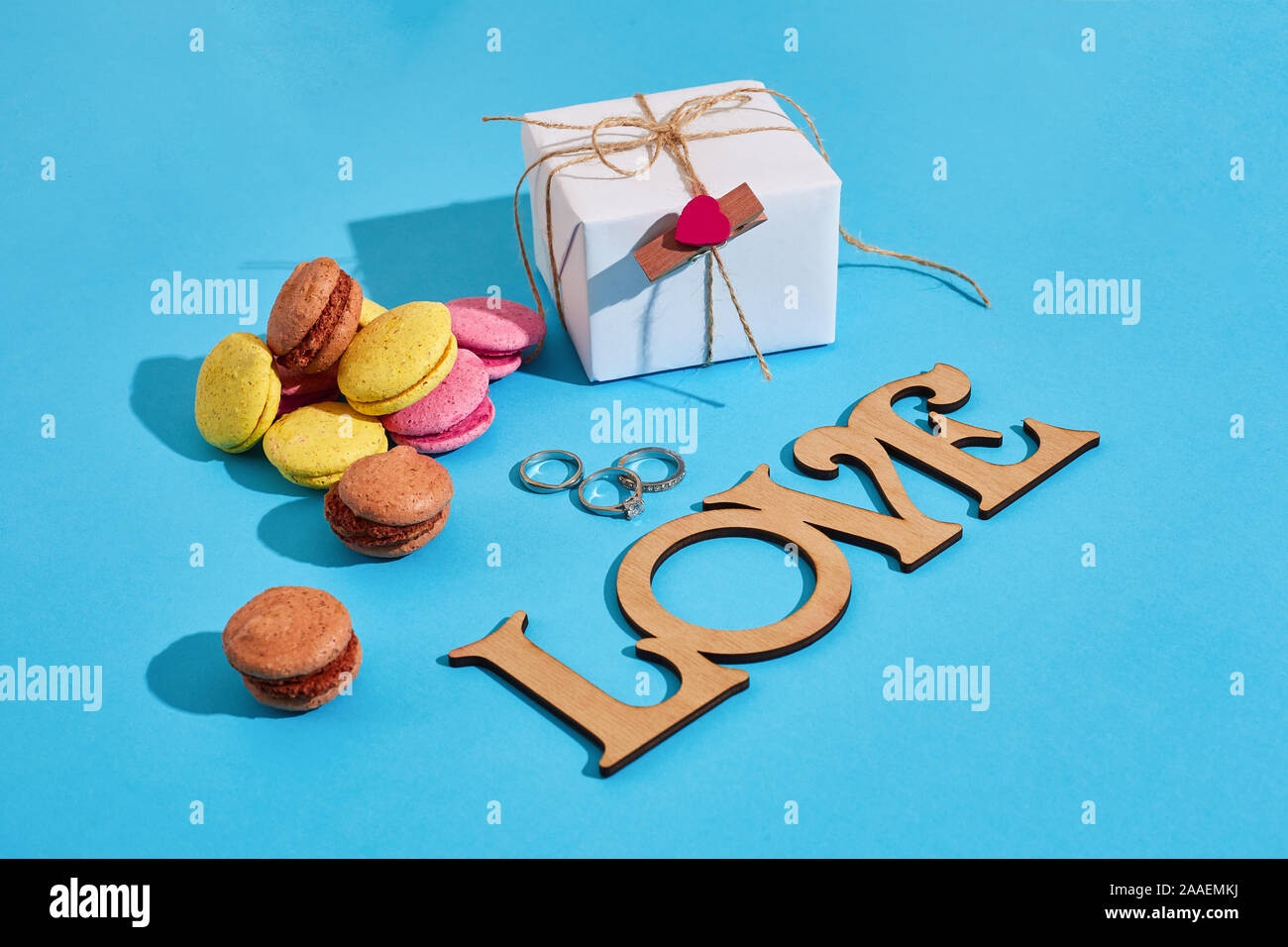 Macaroons and gift box on a blue background with the words I lov Stock ...