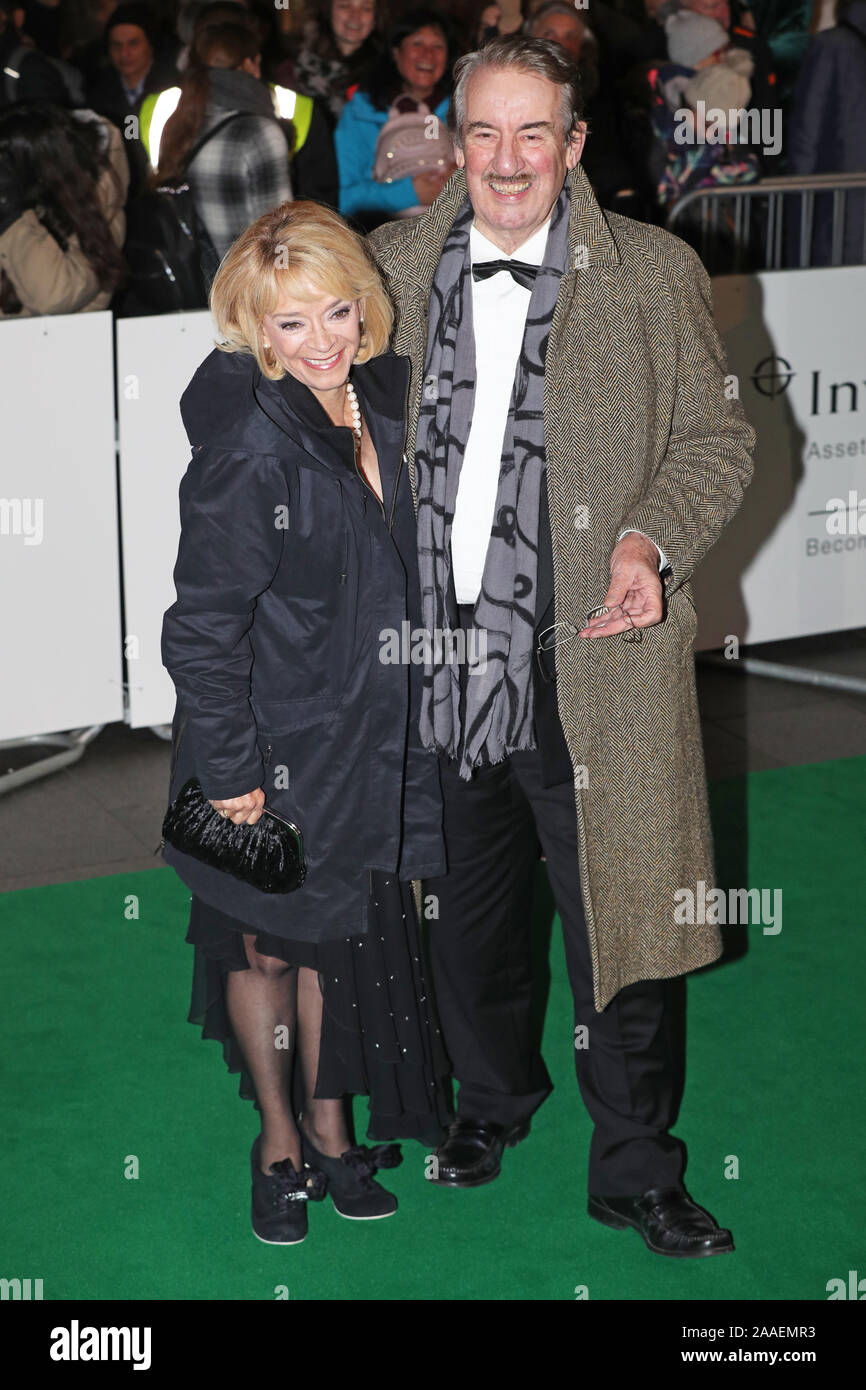 John Challis and his wife Carol arrive at the Empire Cinema in ...