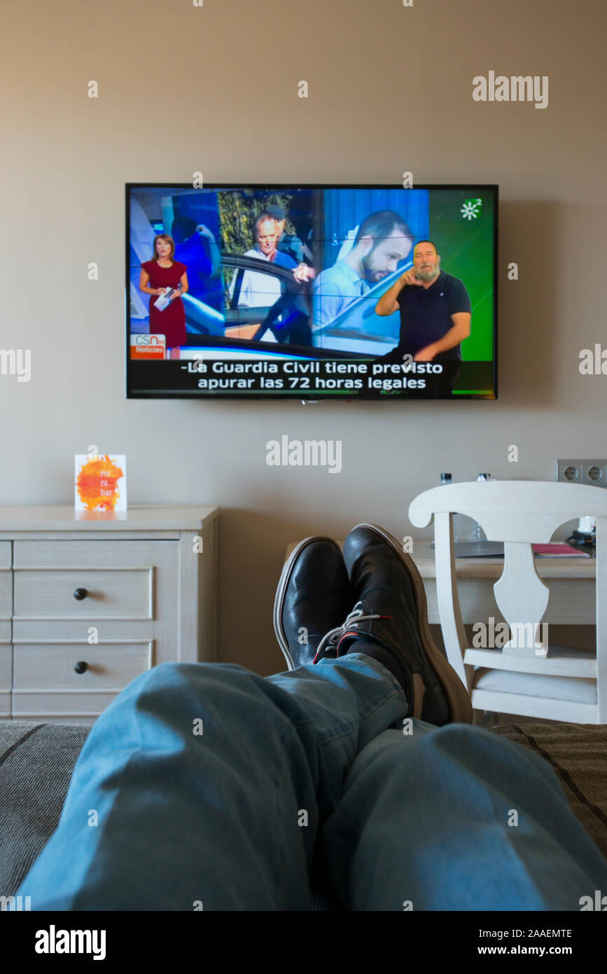 Corporate man in bed watching TV Stock Photo - Alamy