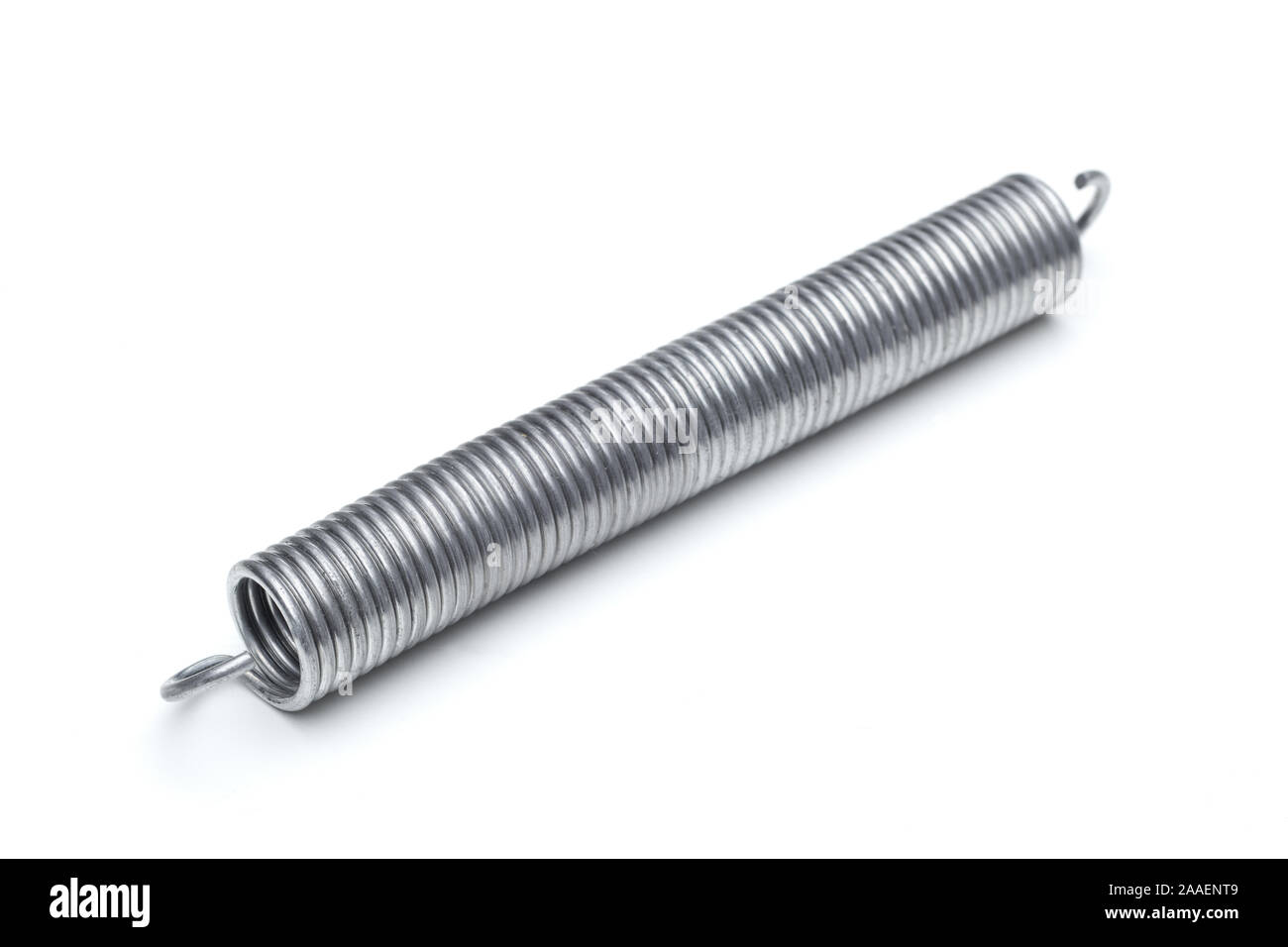 Steel compression spring on white Stock Photo - Alamy