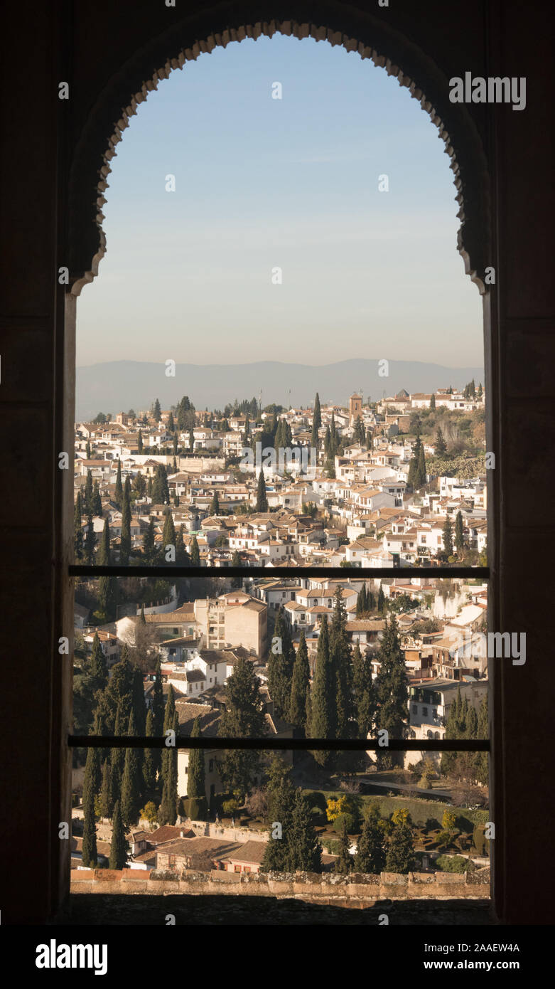 A view of the city of Granada from a window in the Alhambra palace ...