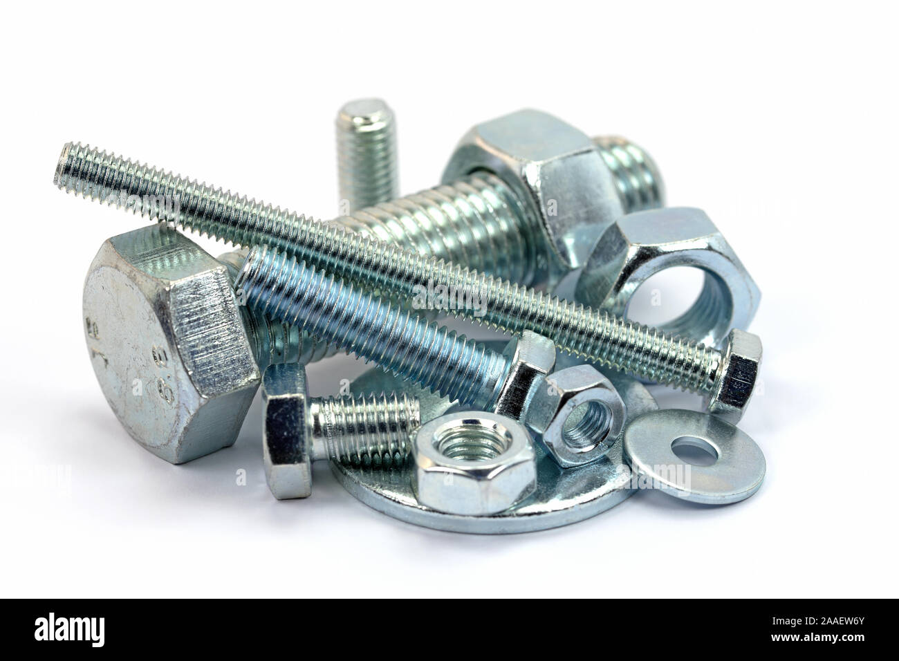 Metal screws in front of white background Stock Photo - Alamy