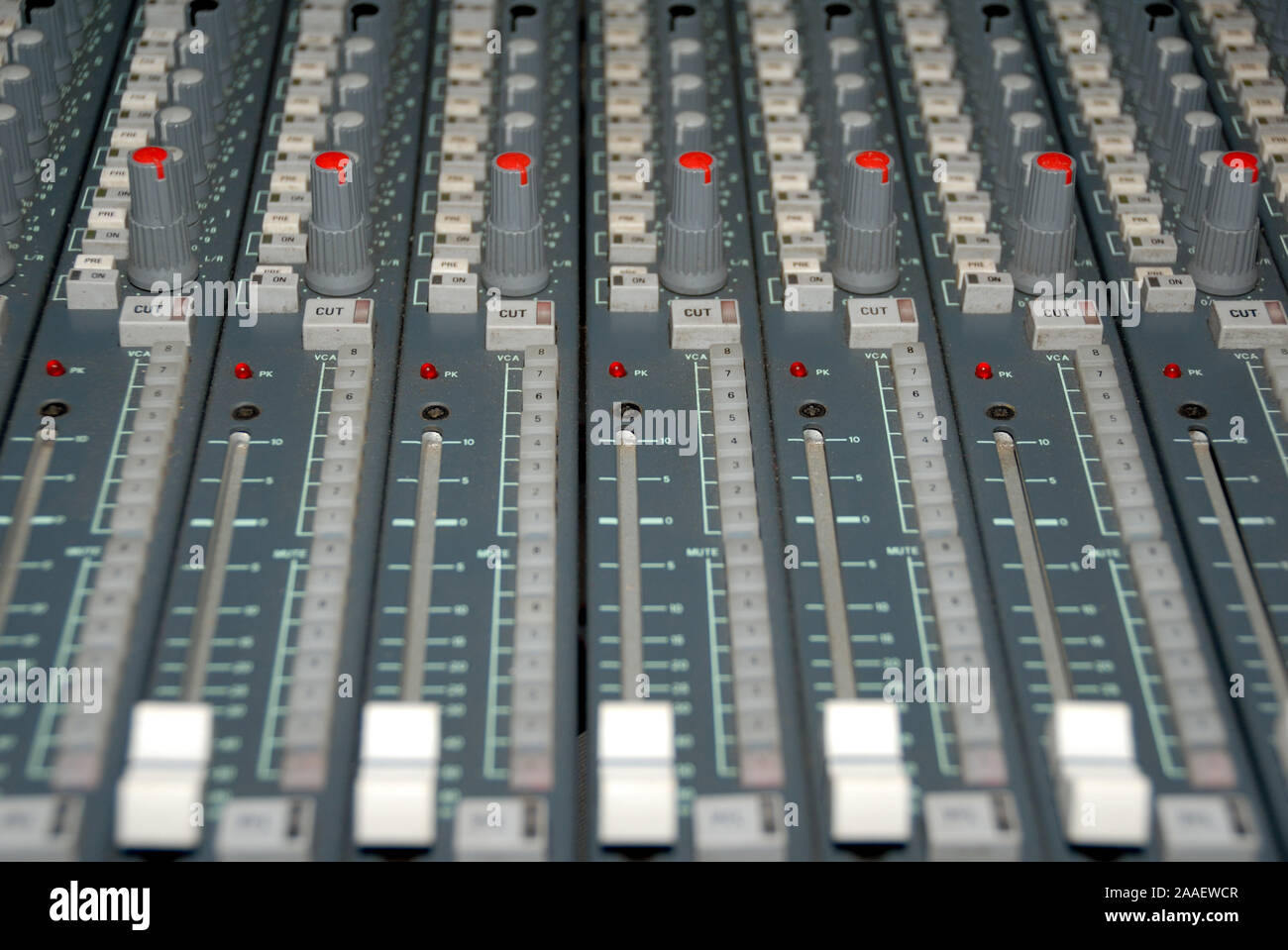 Audio mixing console in a recording studio. Faders and knobs of a sound ...