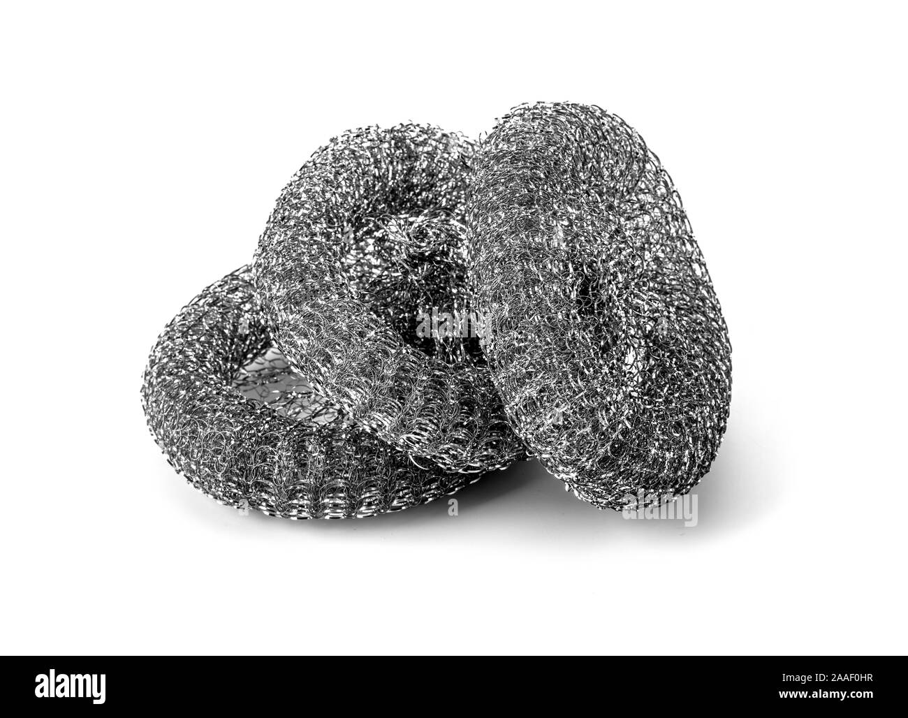 Metal sponge for washing dishes on a white background Stock Photo - Alamy