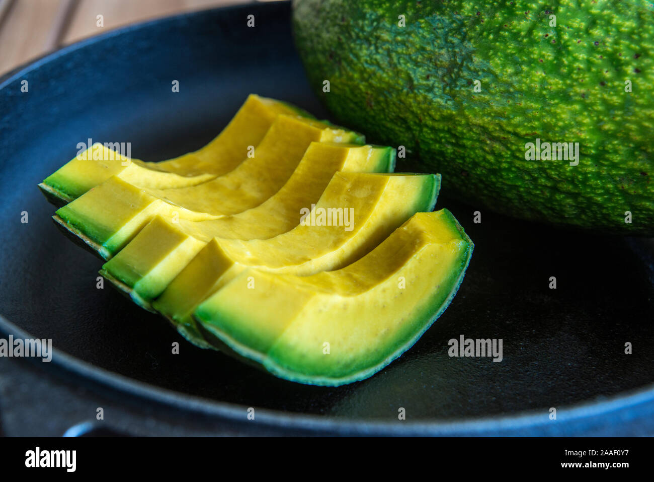 Freshly cut sliced Cuban avocado Stock Photo - Alamy