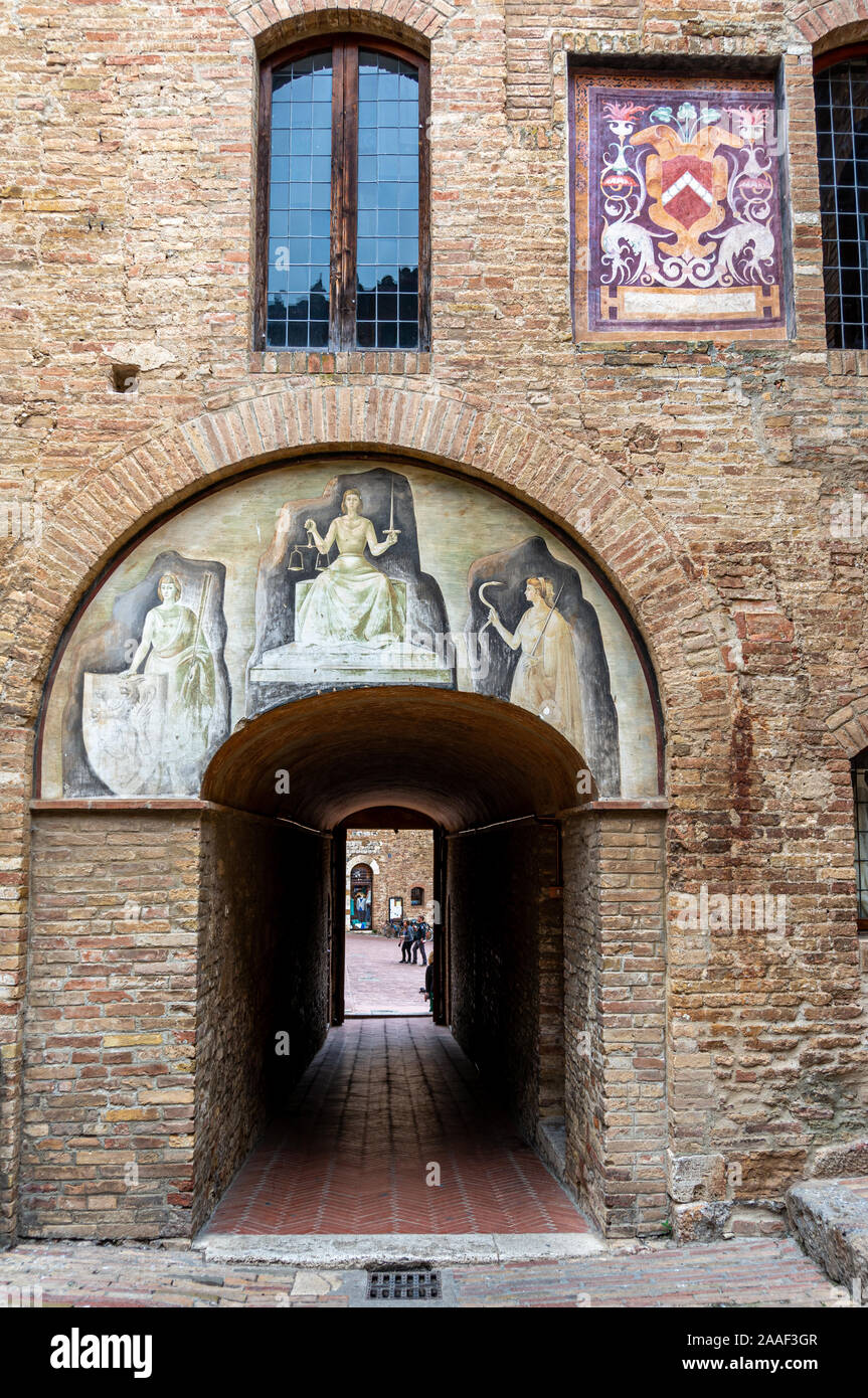 Passageway from street to street through building, San Gimignano ...