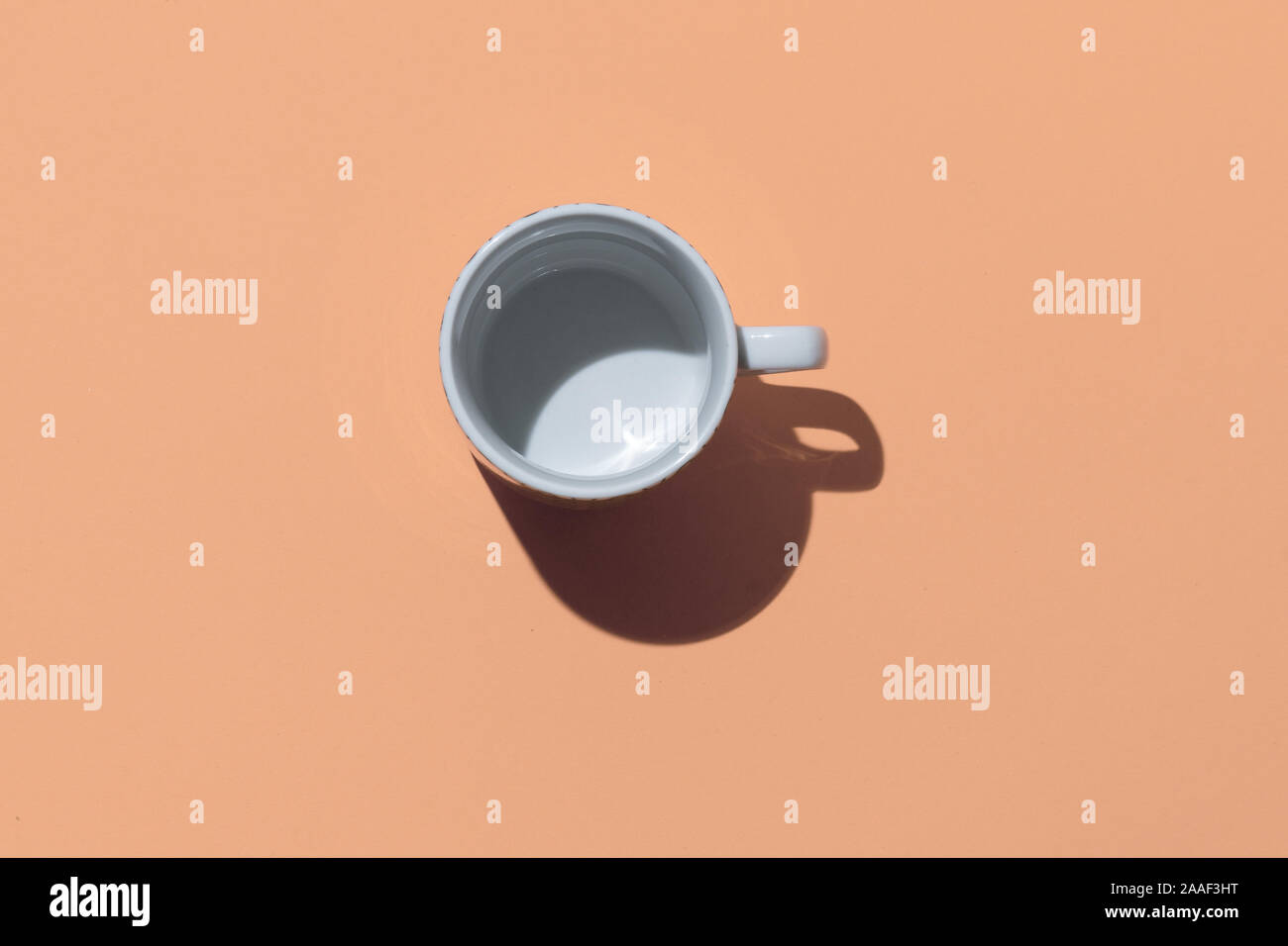 Empty tea cup on beige paper background. Coffee mug from above. Minimal ...