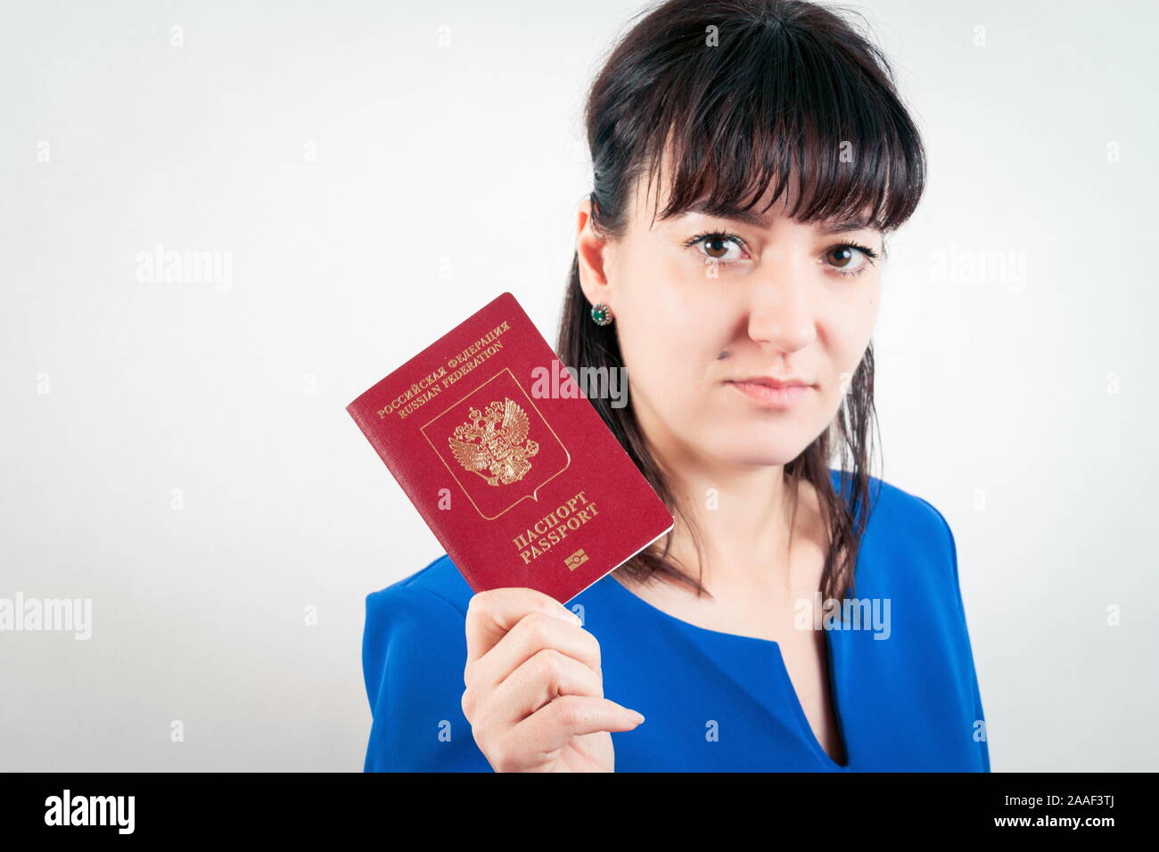 Woman holding russian passport in hi-res stock photography and images ...