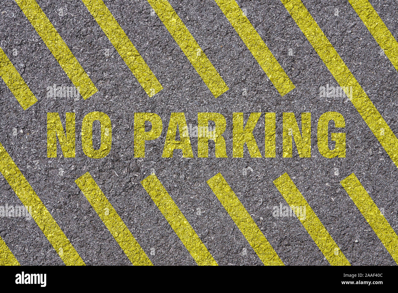 yellow No Parking Lettering on Asphalt Texture Stock Photo - Alamy