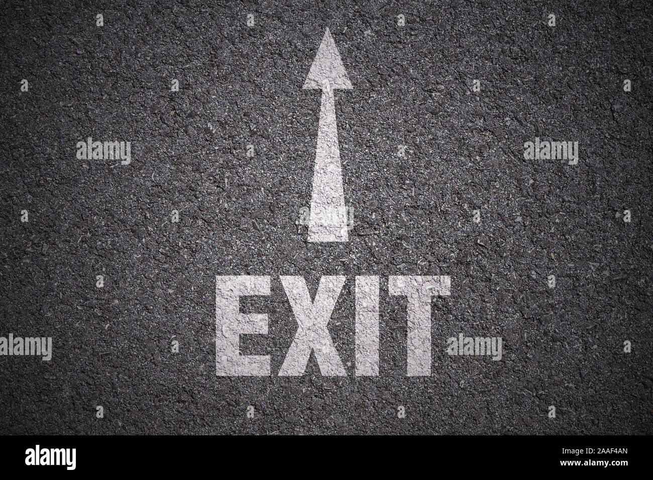 white arrow and exit lettering on asphalt background Stock Photo - Alamy