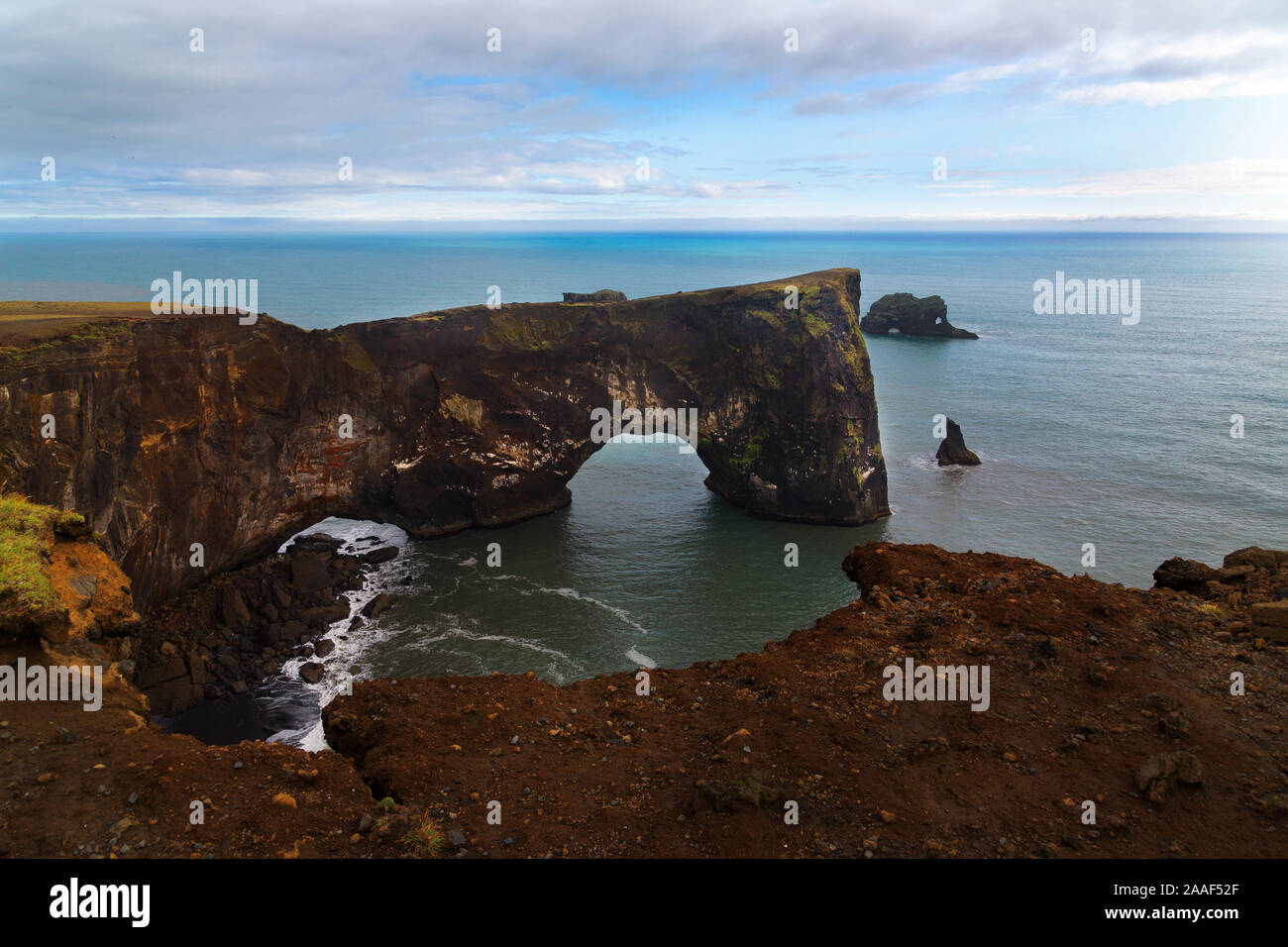 Dyrholaey arch on the coast of Reynisfjara near Vik, Iceland Stock ...