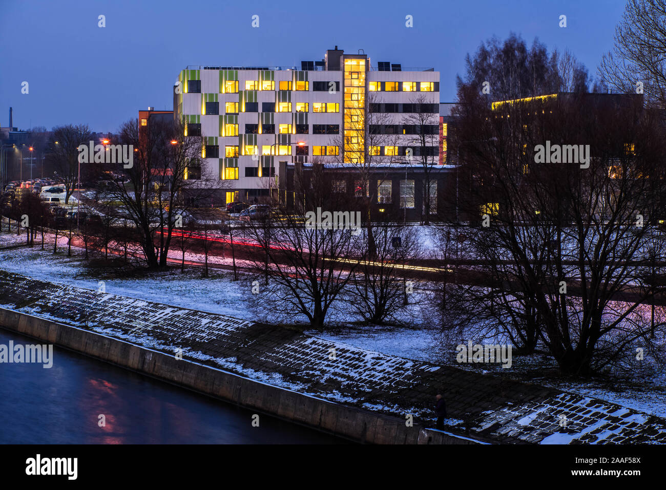 Modern design of office building. Modern architecture in twilight. Snow ...