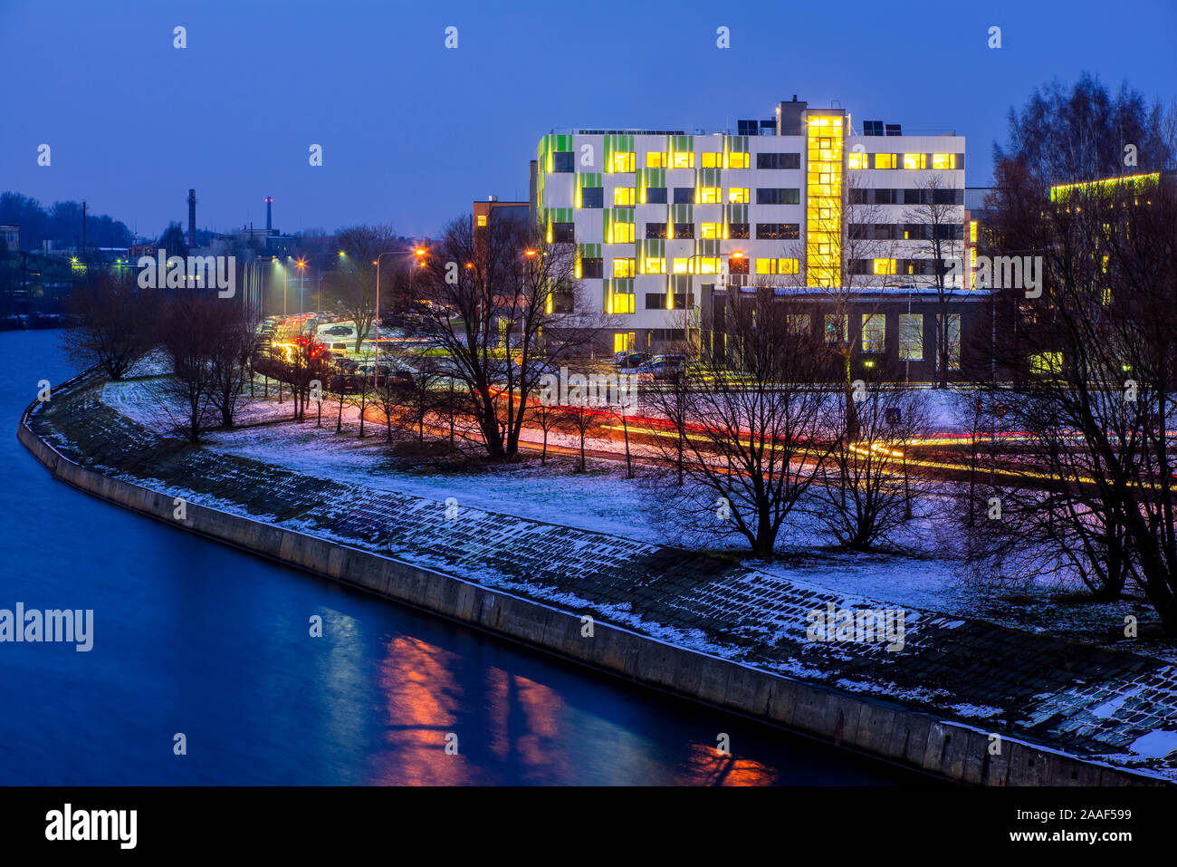 Modern design of office building. Modern architecture in twilight. Snow ...