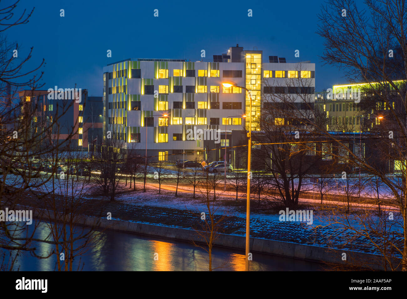 Modern design of office building. Modern architecture in twilight. Snow ...