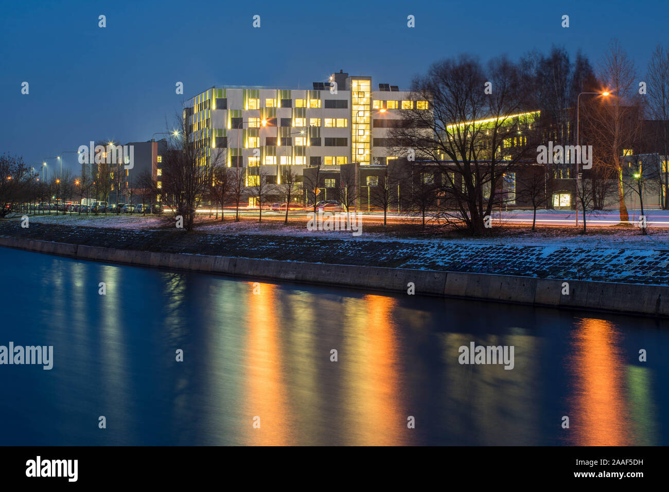 Modern design of office building. Modern architecture in twilight. Snow ...