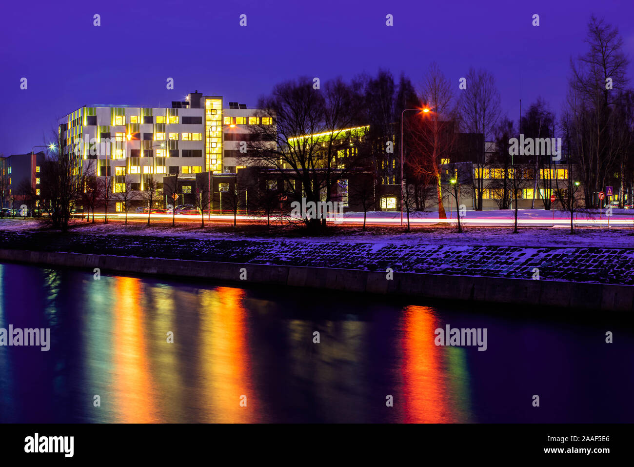 Modern design of office building. Modern architecture in twilight. Snow ...