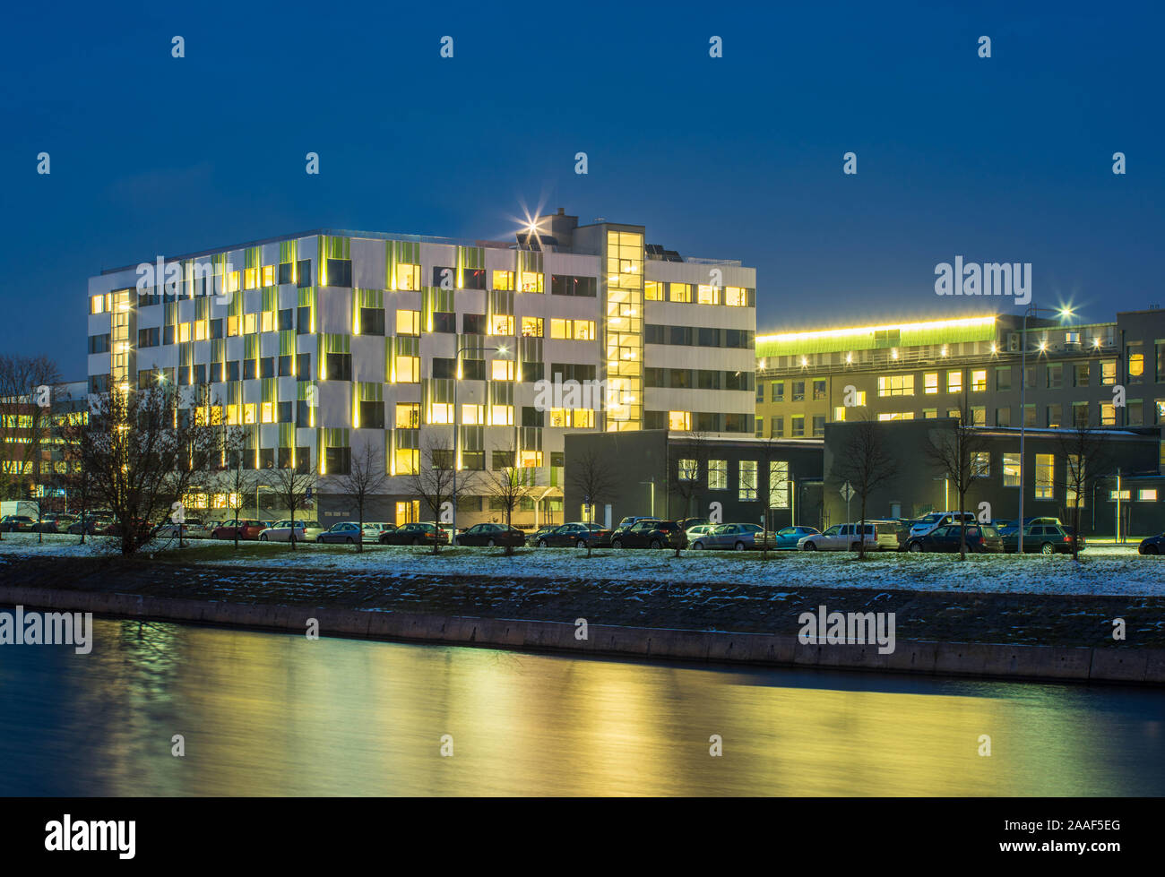 Modern design of office building. Modern architecture in twilight. Snow ...